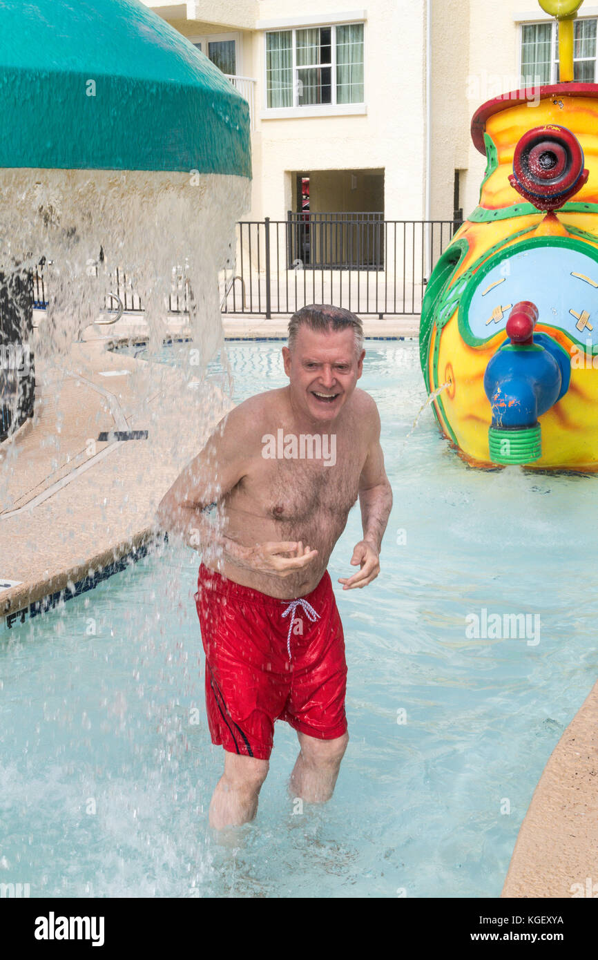 Senior Man Enjoying Resort Swimming Pool, USA Stock Photo - Alamy