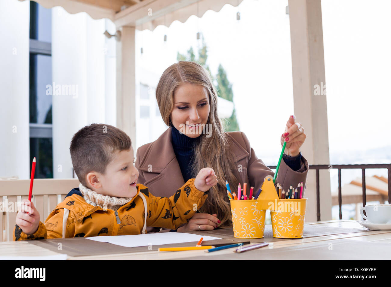 mom with boy draw colored pencils Stock Photo - Alamy