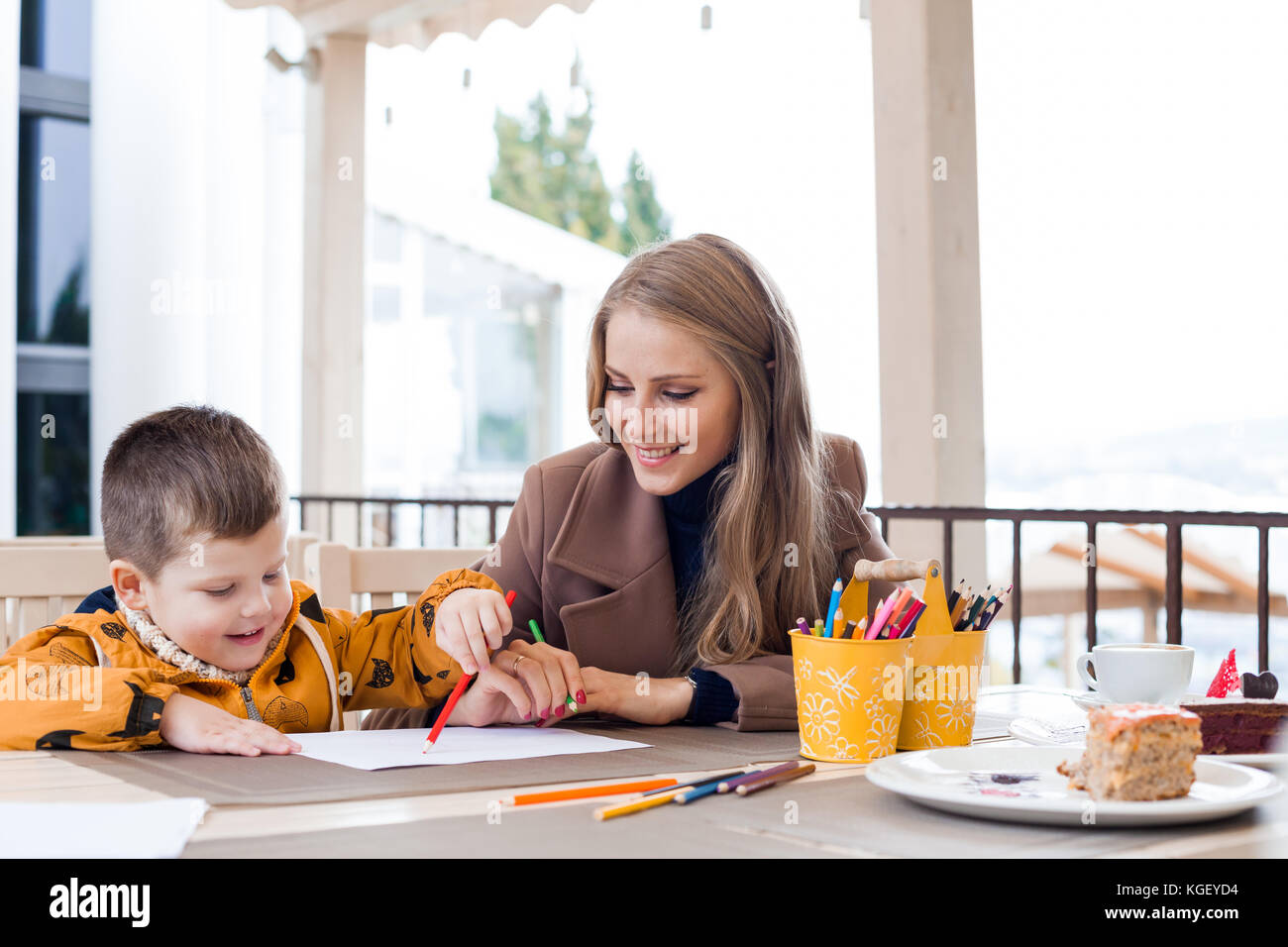 mom with boy draw colored pencils Stock Photo - Alamy