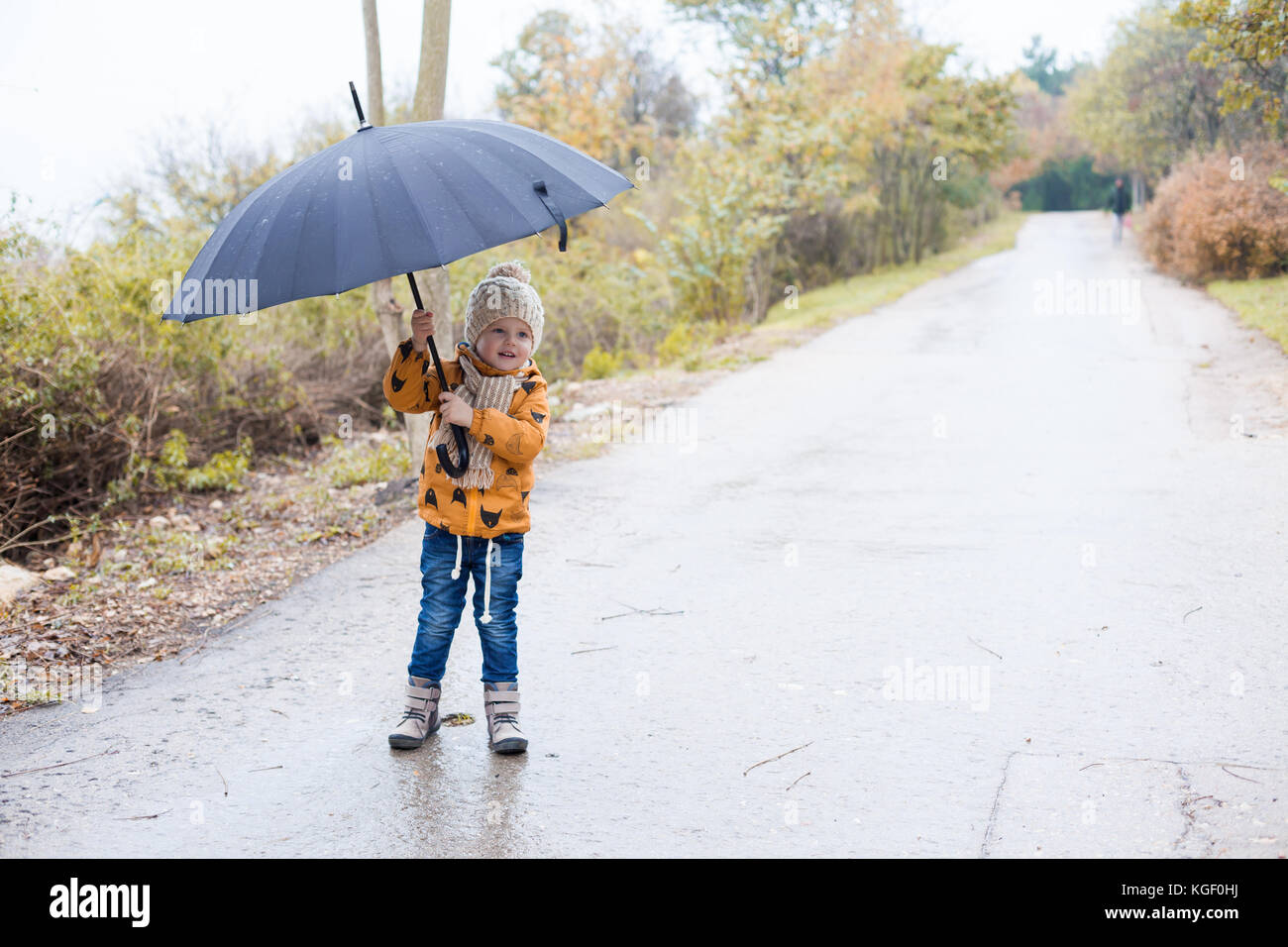 Child In Rain Hat High Resolution Stock Photography and Images - Alamy