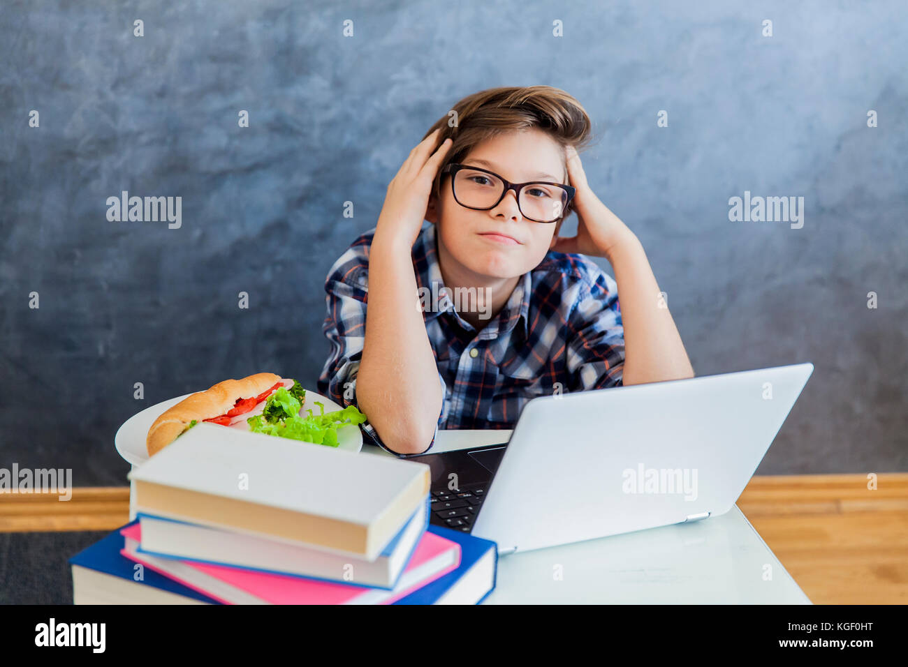 Teen boy glasses working on hi-res stock photography and images - Alamy