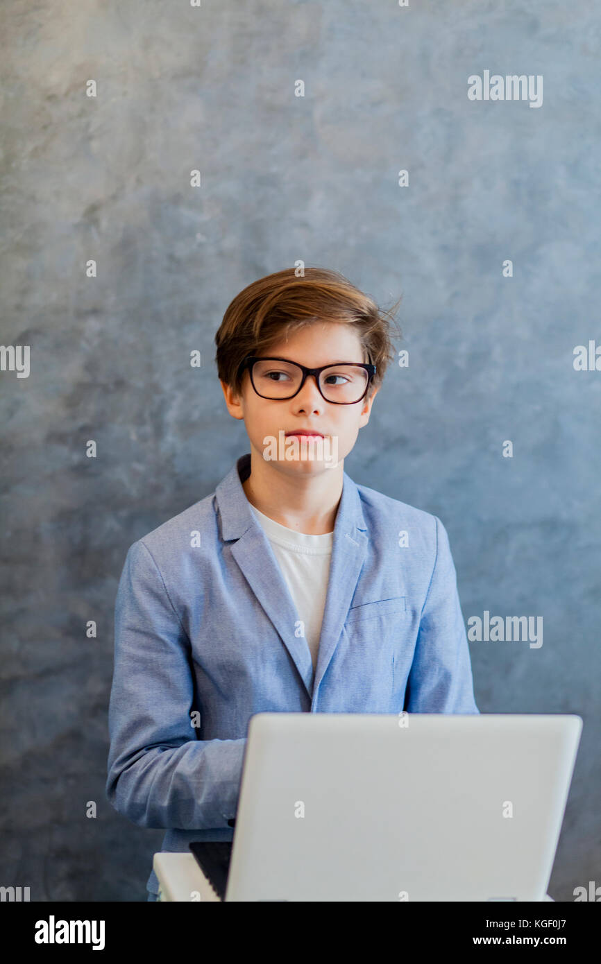 Portrait of teen boy using laptop Stock Photo - Alamy