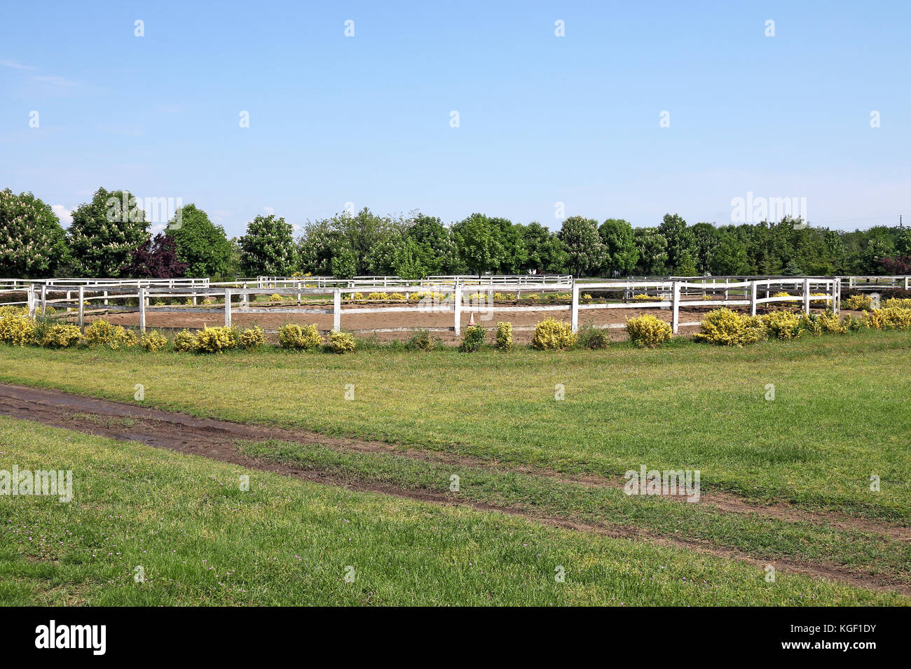 white corral fence and country road landscape Stock Photo - Alamy