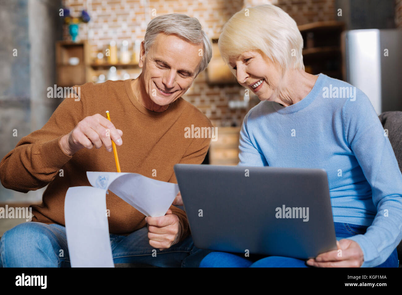 Nice joyful man pointing at his notes Stock Photo - Alamy
