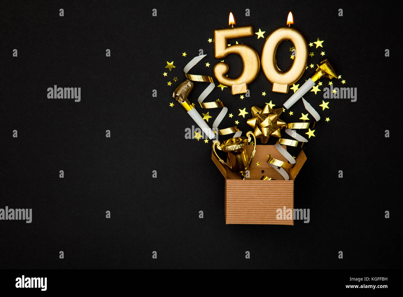 Number 50 gold celebration candle and gift box background Stock Photo ...