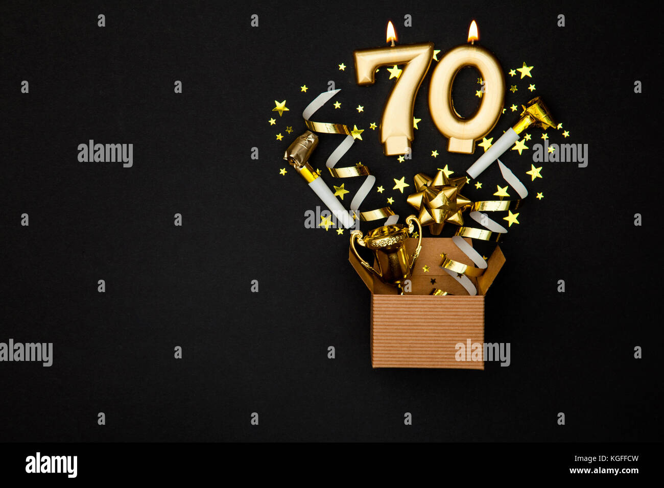 Number 70 gold celebration candle and gift box background Stock Photo ...