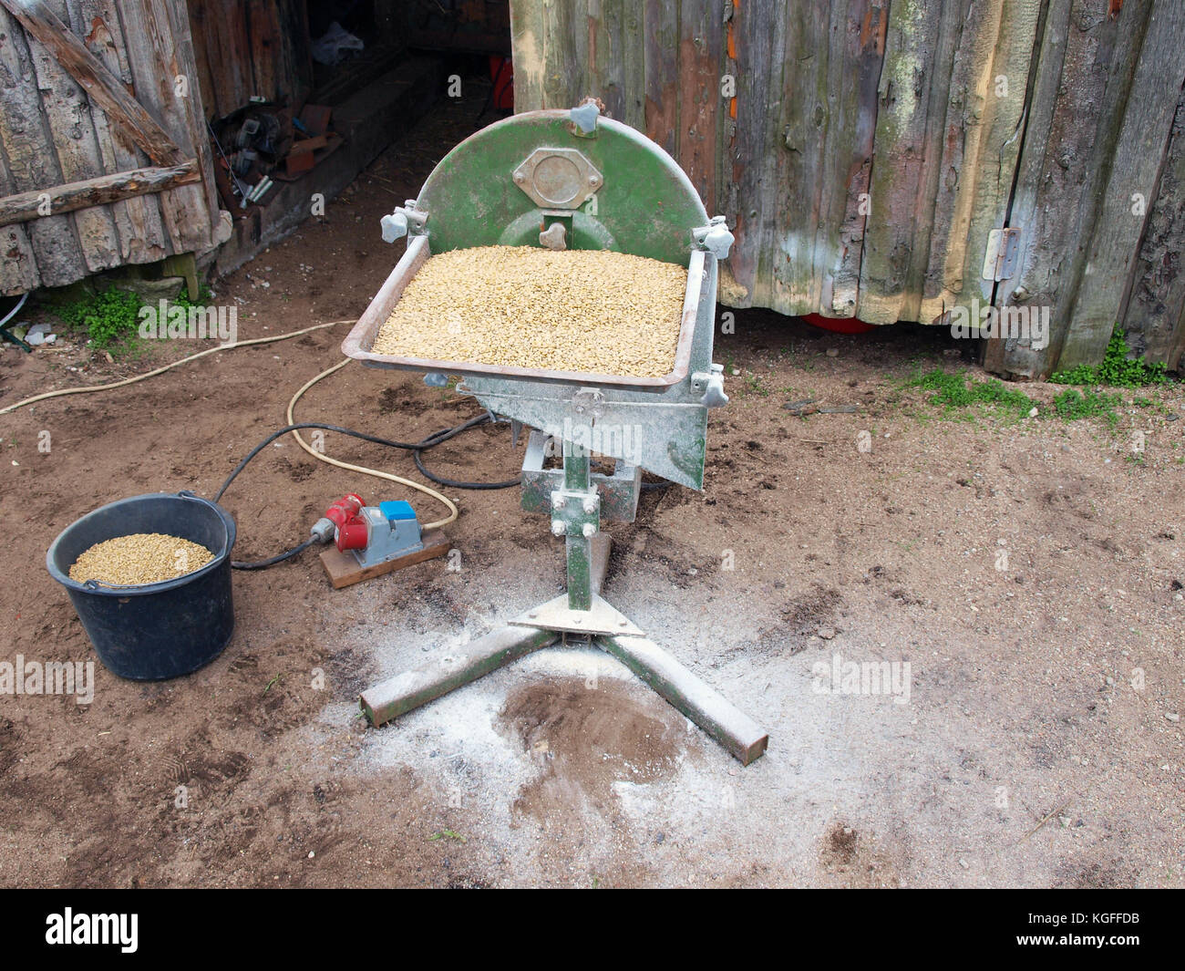 Small portable electric grain mill outdoor in country farm Stock Photo ...