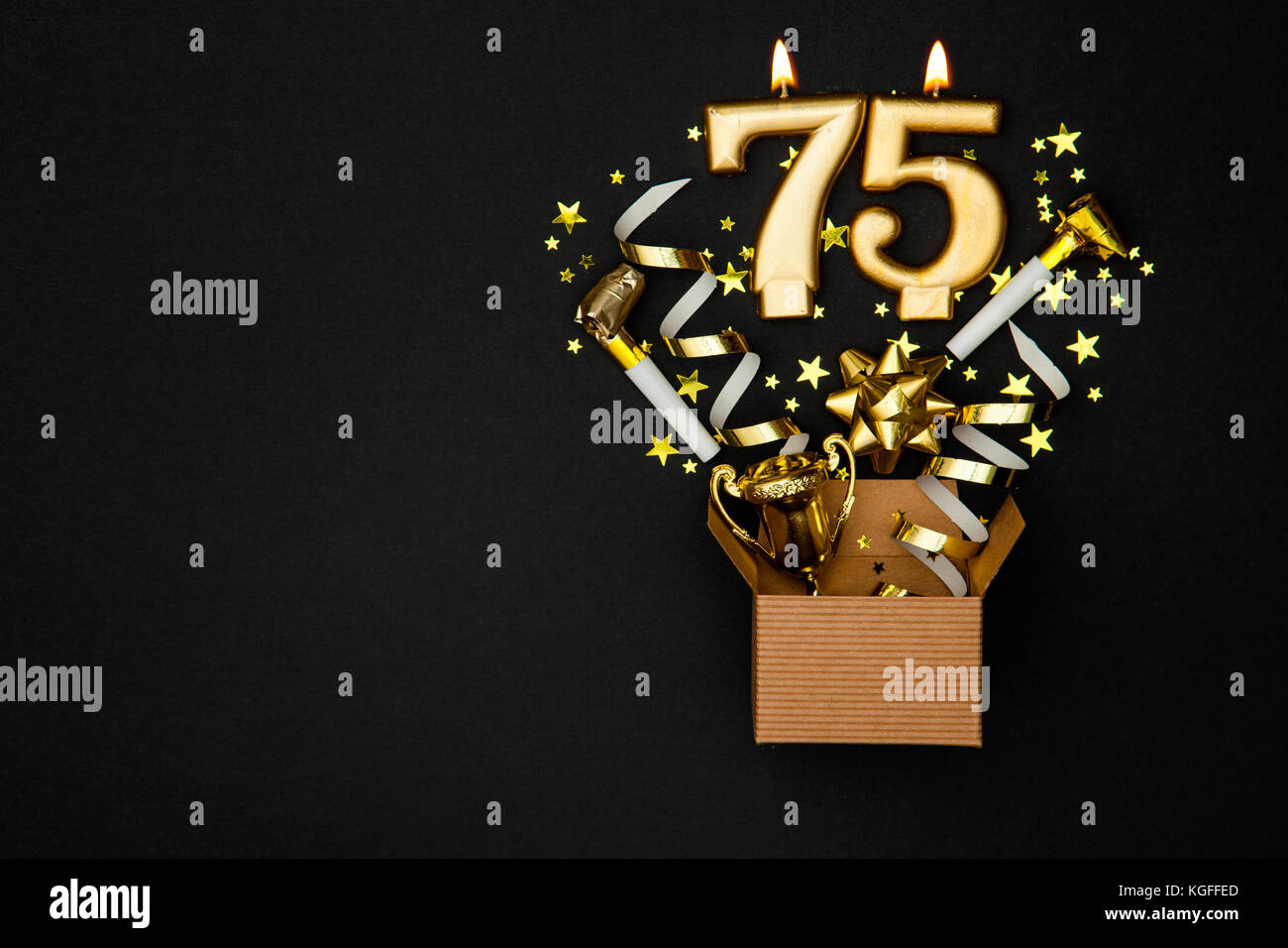 Number 75 gold celebration candle and gift box background Stock Photo ...