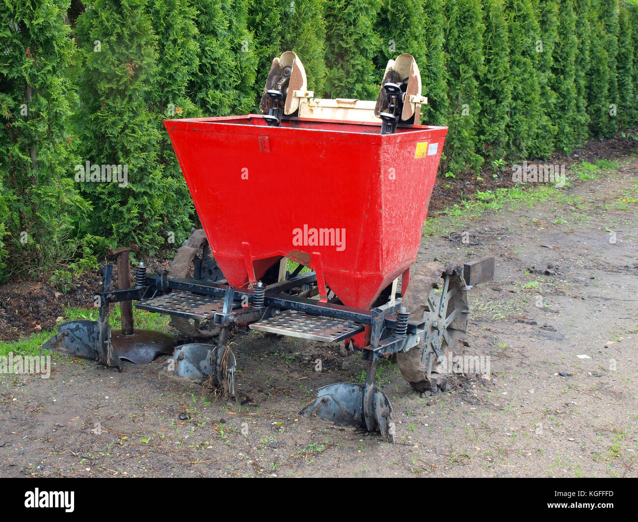 Tractor powered two furrow potato planter rear view Stock Photo - Alamy