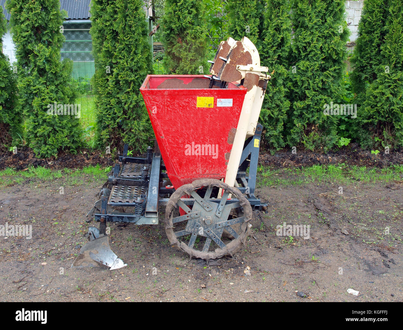 Tractor powered two furrow potato planter side view Stock Photo - Alamy