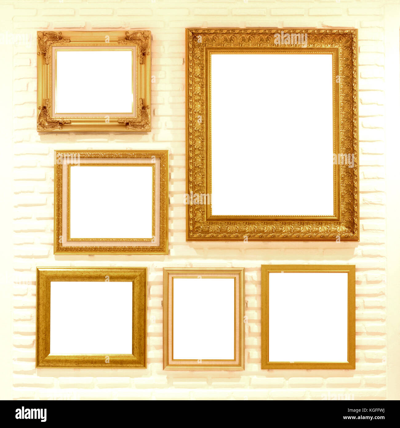 pile of empty golden picture frames on brick wall Stock Photo - Alamy