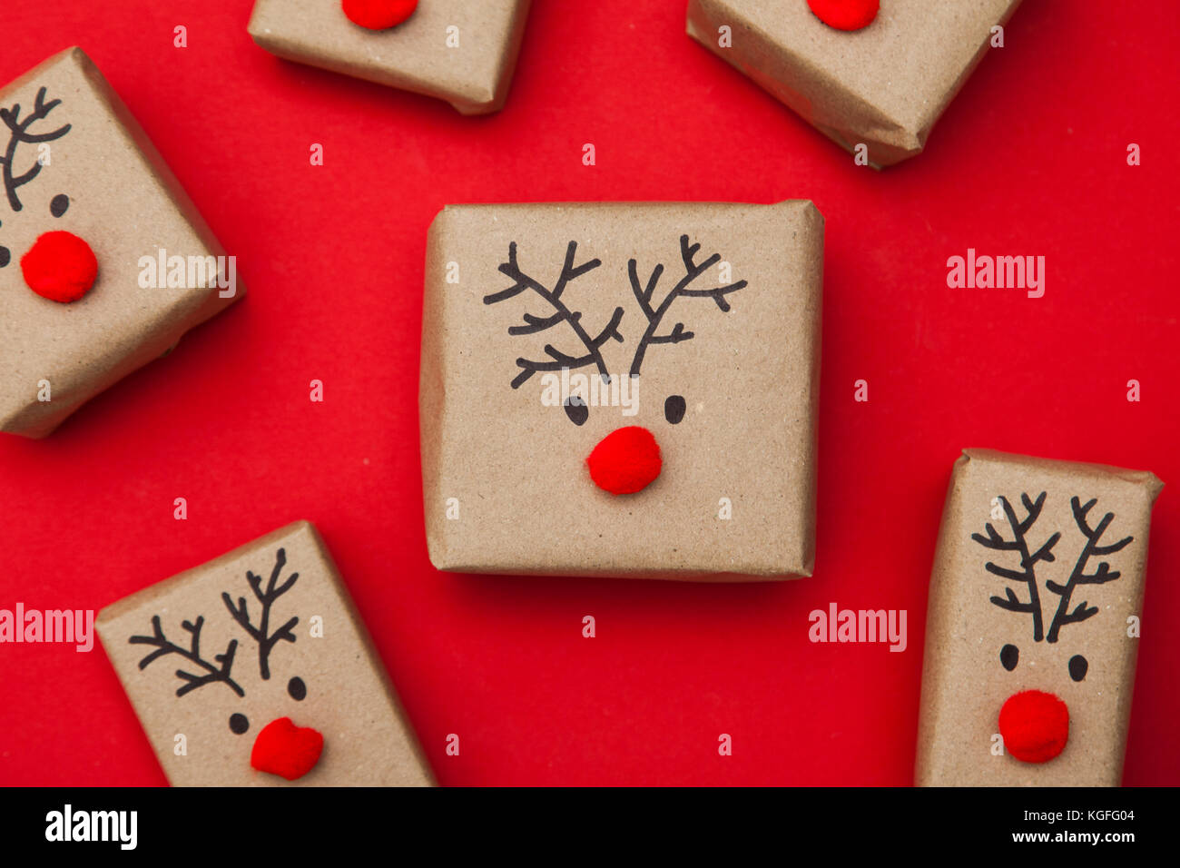 Christmas gift boxes with reindeer faces Stock Photo - Alamy