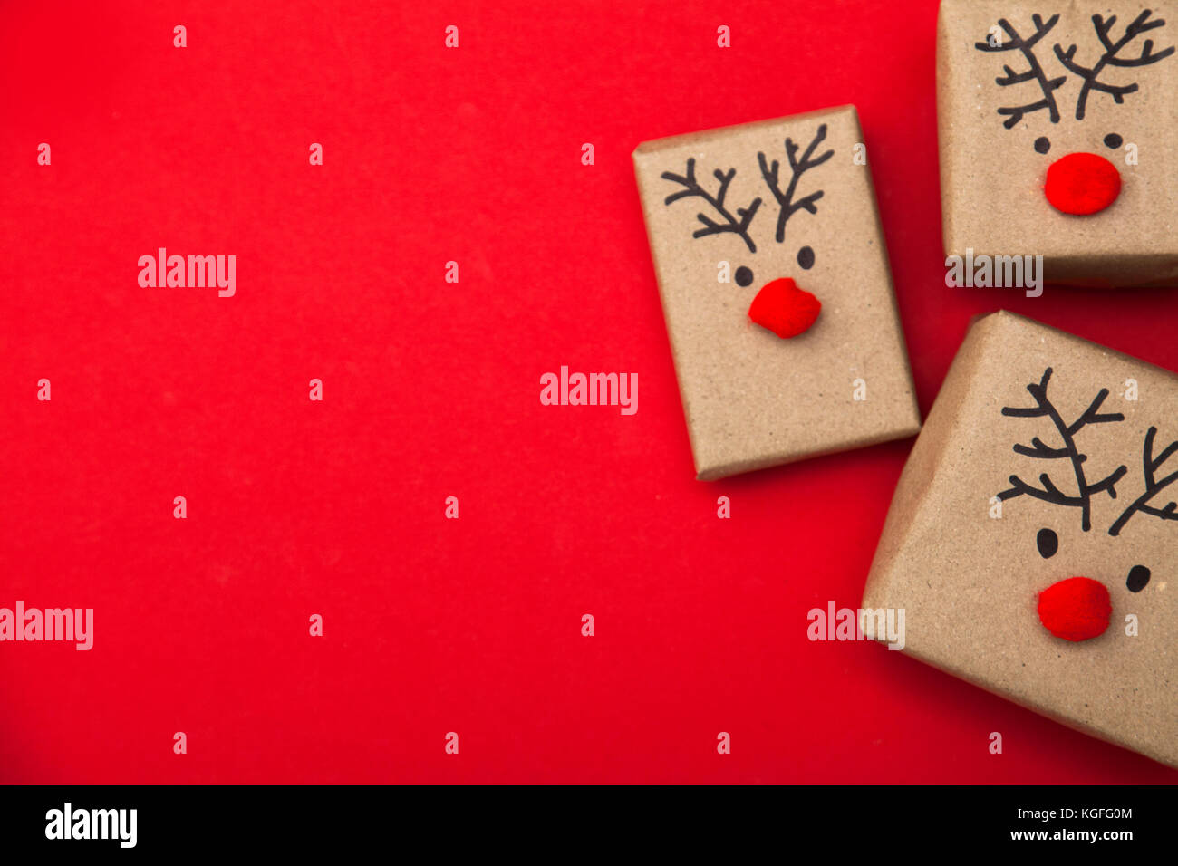 Christmas gift boxes with reindeer faces Stock Photo - Alamy