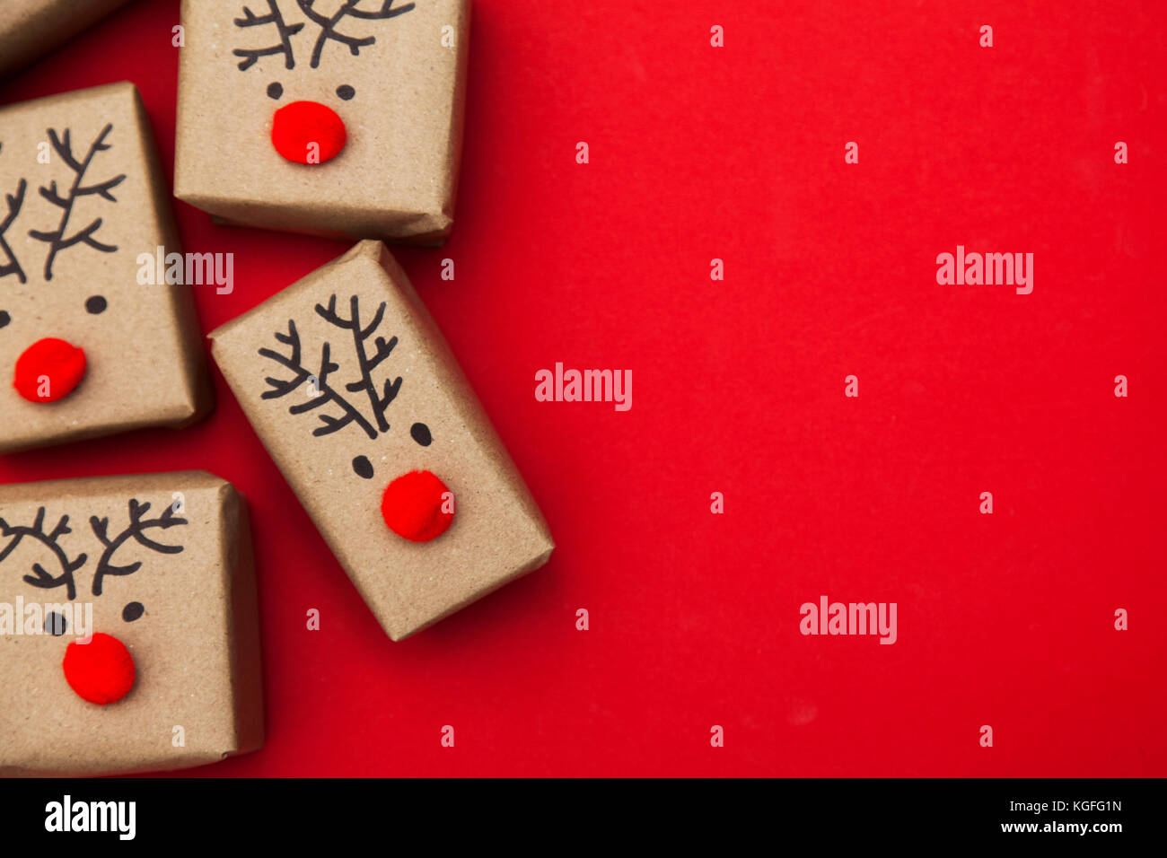 Christmas gift boxes with reindeer faces Stock Photo - Alamy