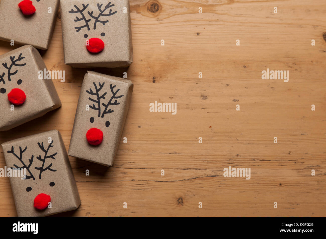 Christmas gift boxes with reindeer faces Stock Photo - Alamy