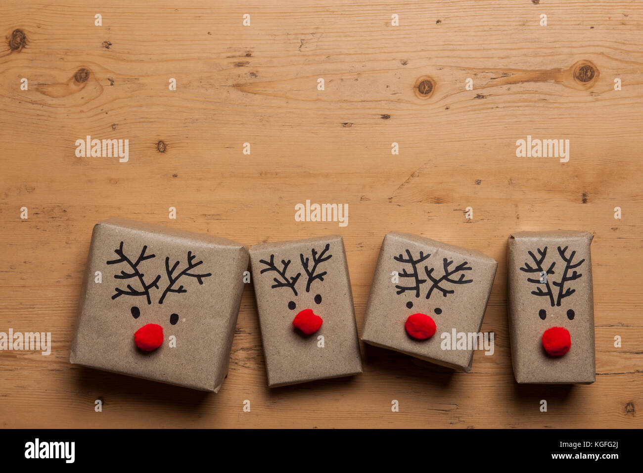 Christmas gift boxes with reindeer faces Stock Photo - Alamy