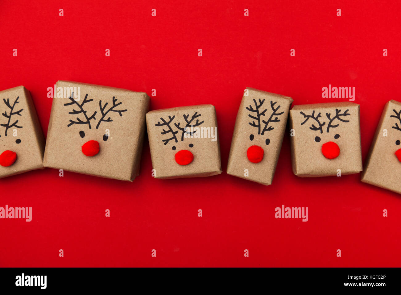 Christmas gift boxes with reindeer faces Stock Photo - Alamy