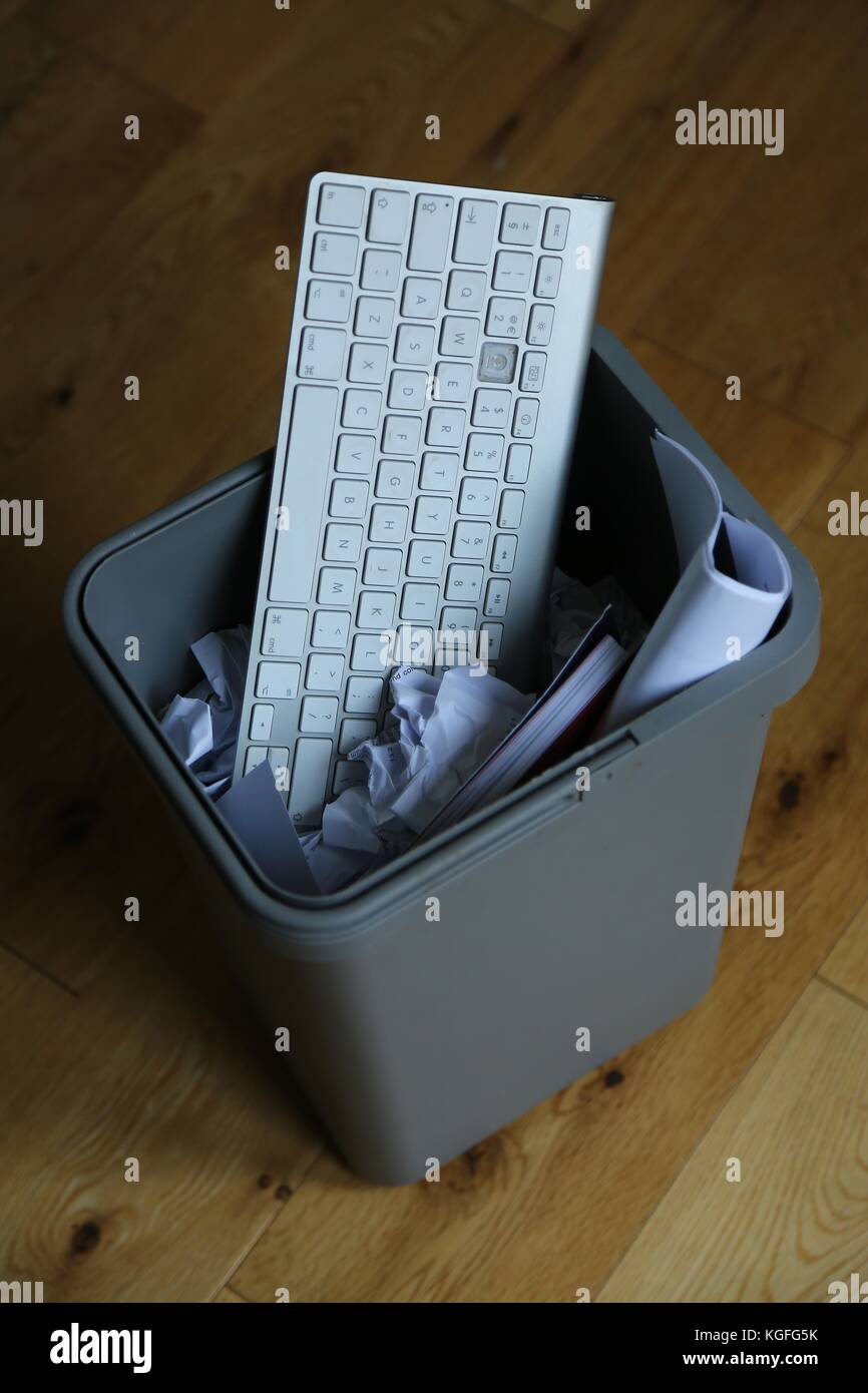 A broken bluetooth Apple Computer Keyboard in a bin Stock Photo - Alamy