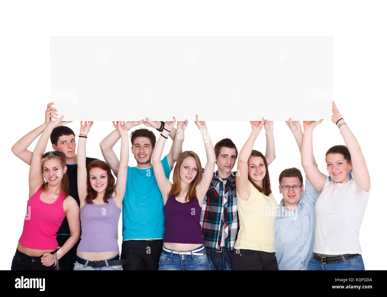 Group of nine young smiling people holding blank banner over their ...