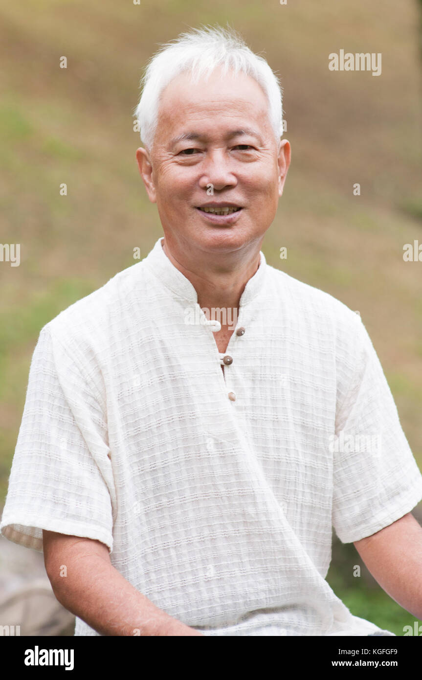 Happy Asian senior man relaxing at outdoor park Stock Photo - Alamy
