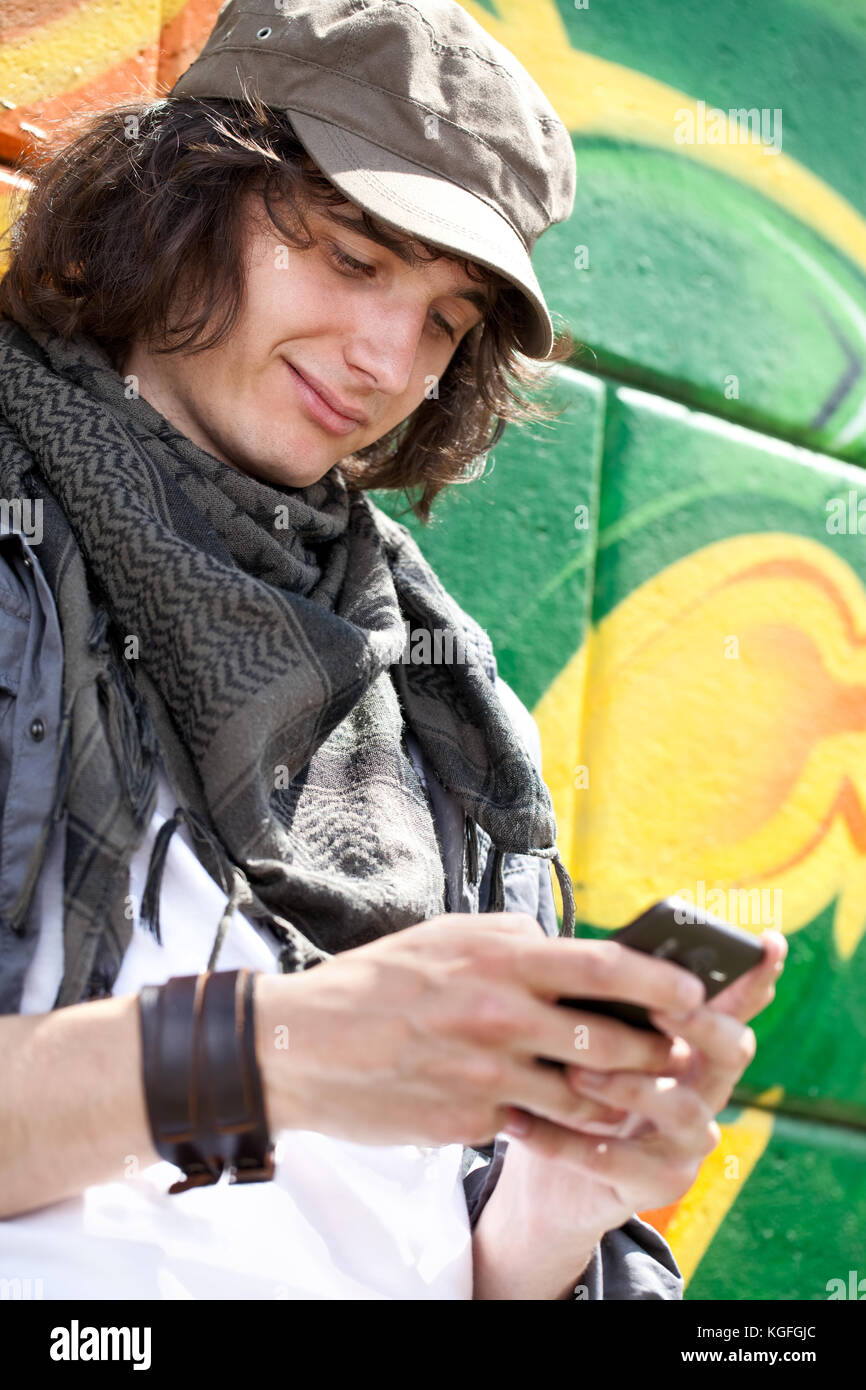 Modern urban guy texting message Stock Photo - Alamy