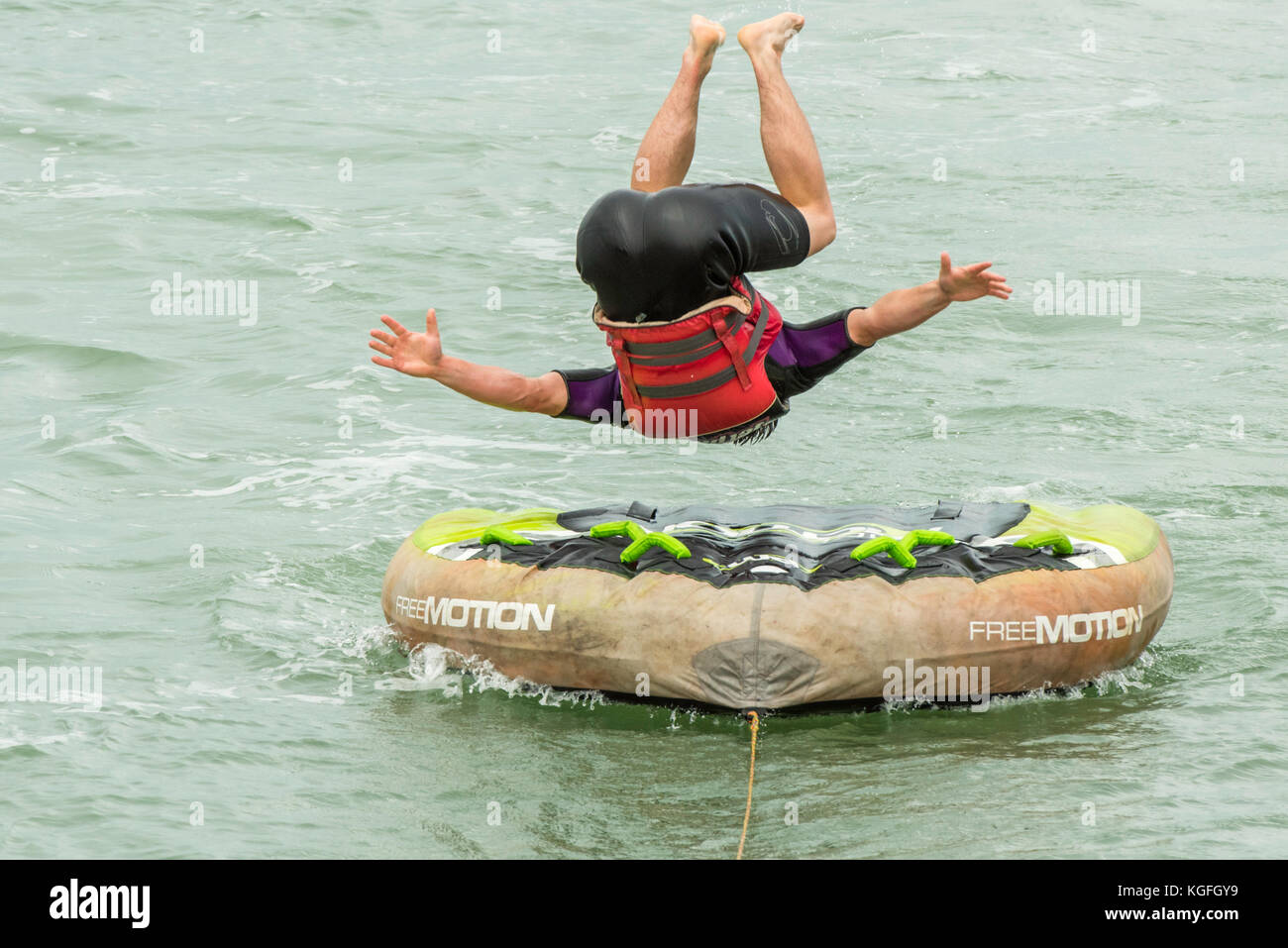 Horizontal close-up of a caucasian man about to back flip on an ...