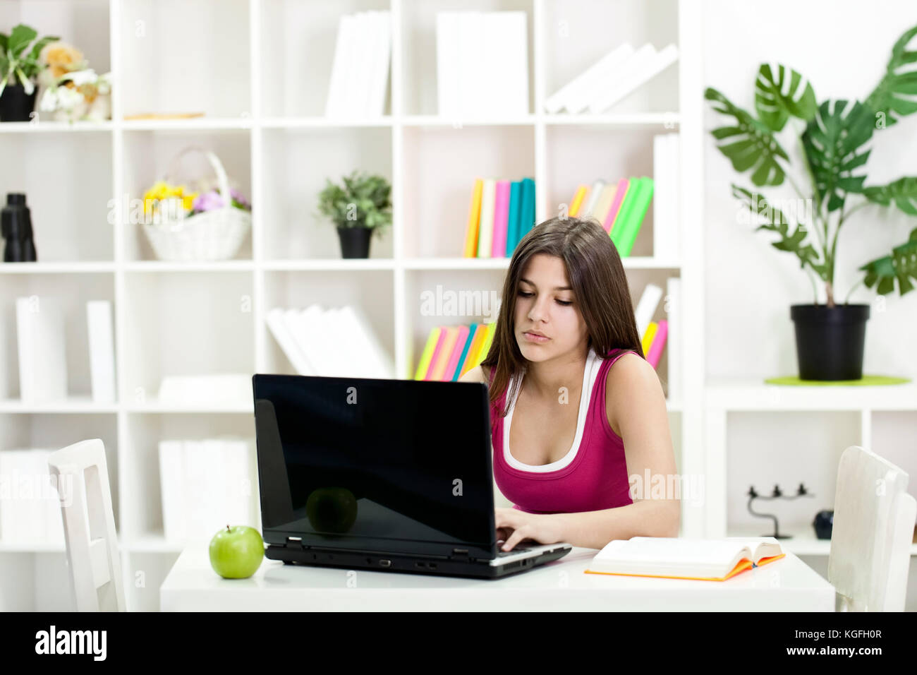 Teenager girl using laptop for learning Stock Photo - Alamy