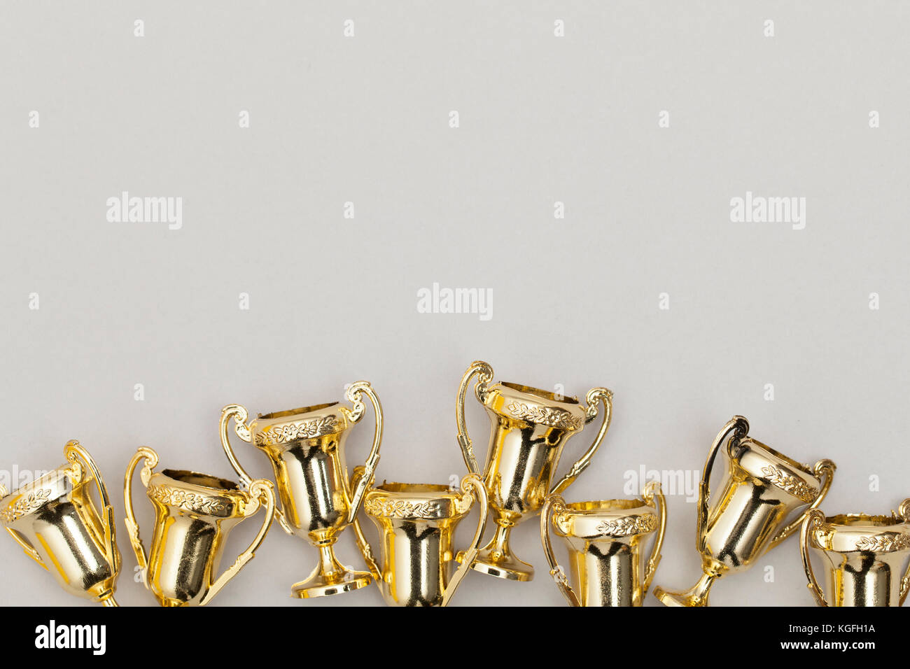Gold winners achievement trophy background Stock Photo - Alamy
