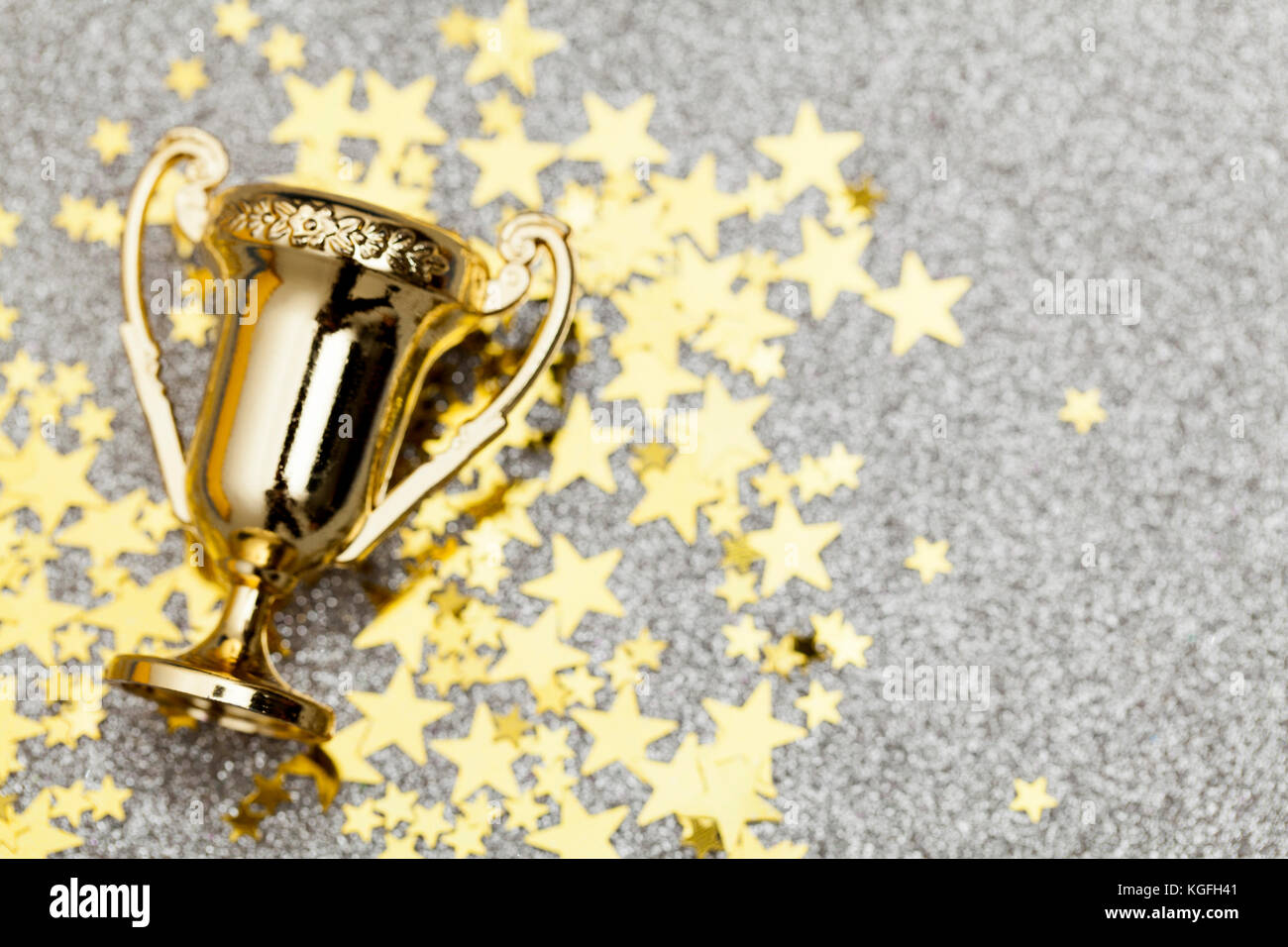 Gold winners achievement trophy background Stock Photo - Alamy