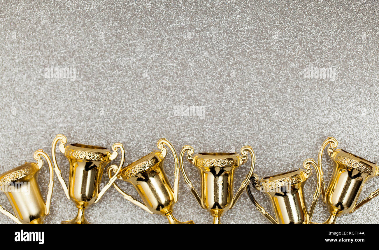 Gold winners achievement trophy background Stock Photo - Alamy