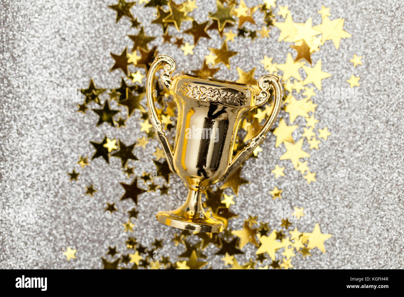 Gold winners achievement trophy background Stock Photo - Alamy