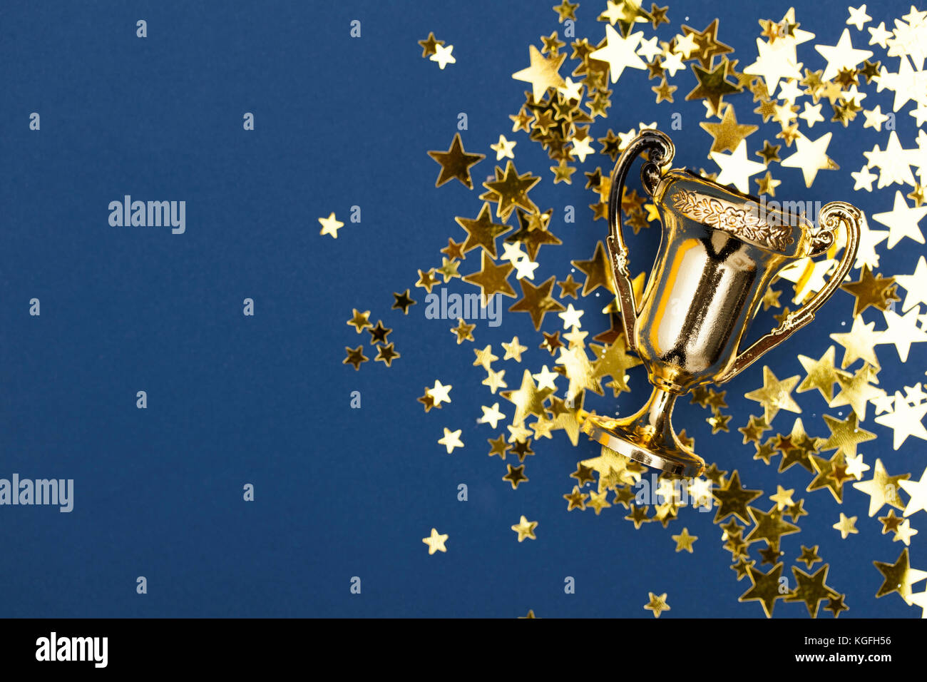 Gold winners achievement trophy background Stock Photo - Alamy