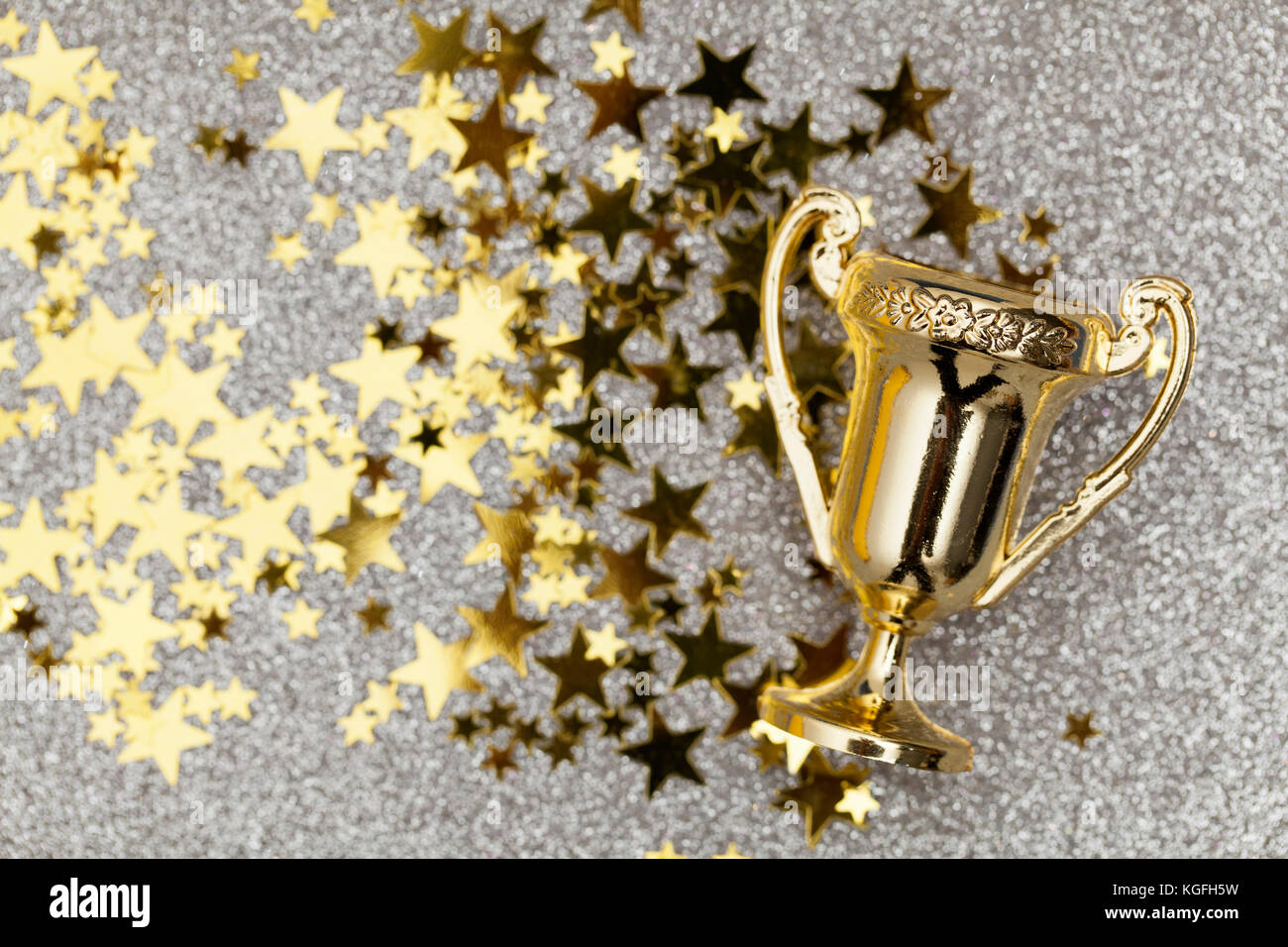 Gold winners achievement trophy background Stock Photo - Alamy