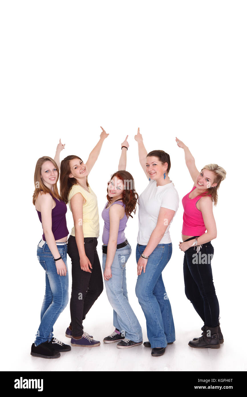 Group of five girls in a row pointing to copy space Stock Photo - Alamy
