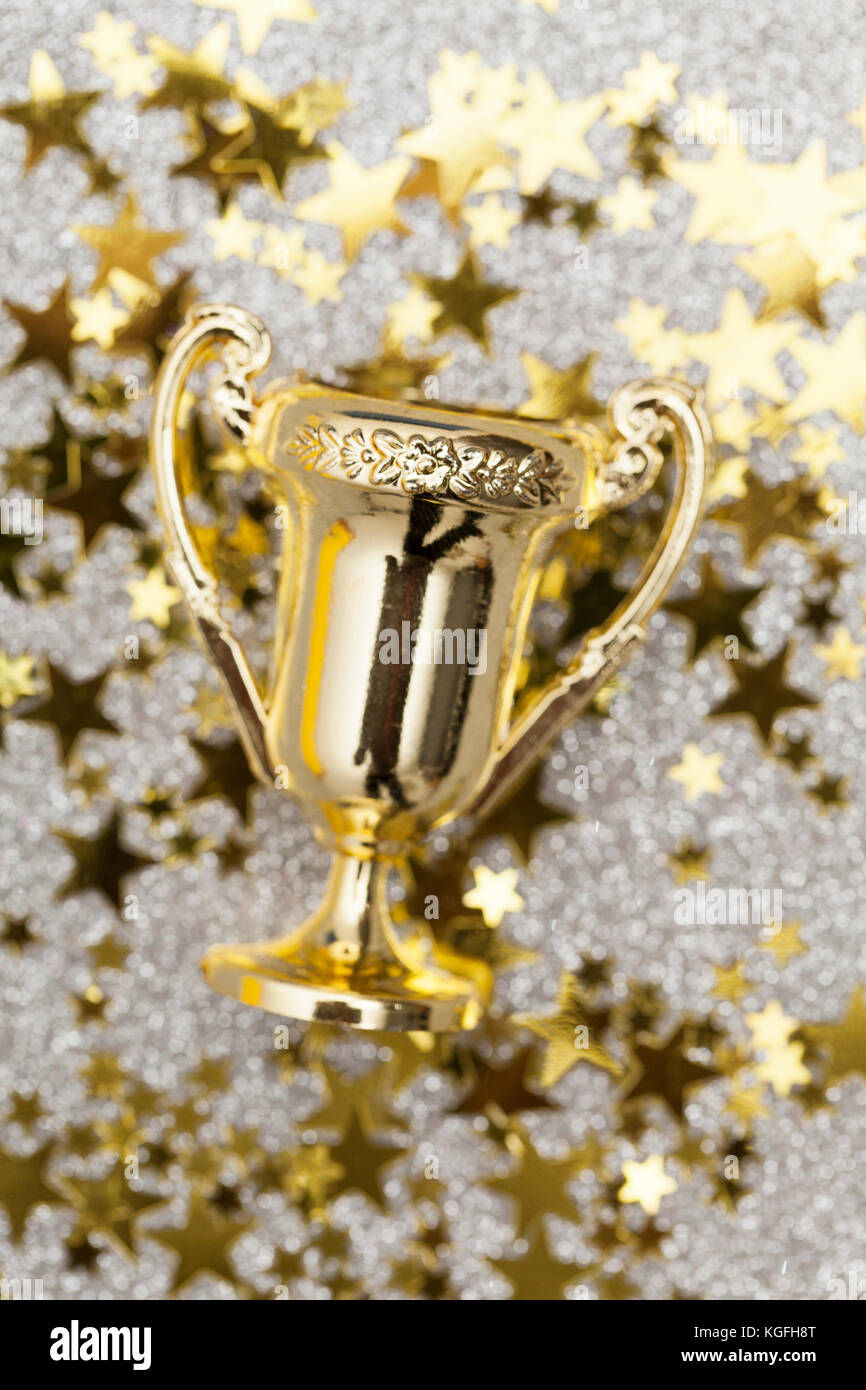 Gold winners achievement trophy background Stock Photo - Alamy