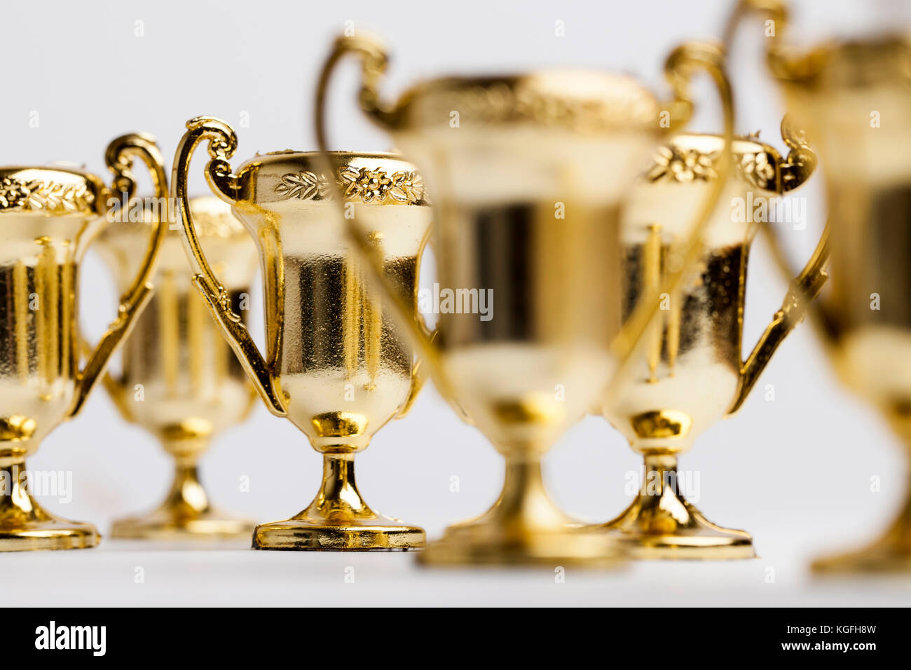 Gold winners achievement trophy background Stock Photo - Alamy