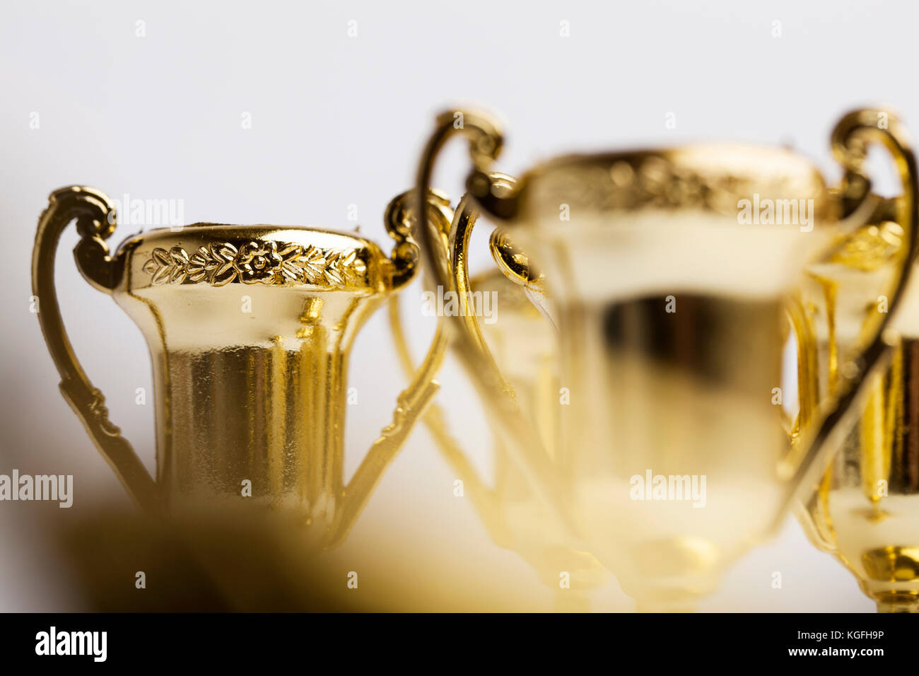 Gold winners achievement trophy background Stock Photo - Alamy