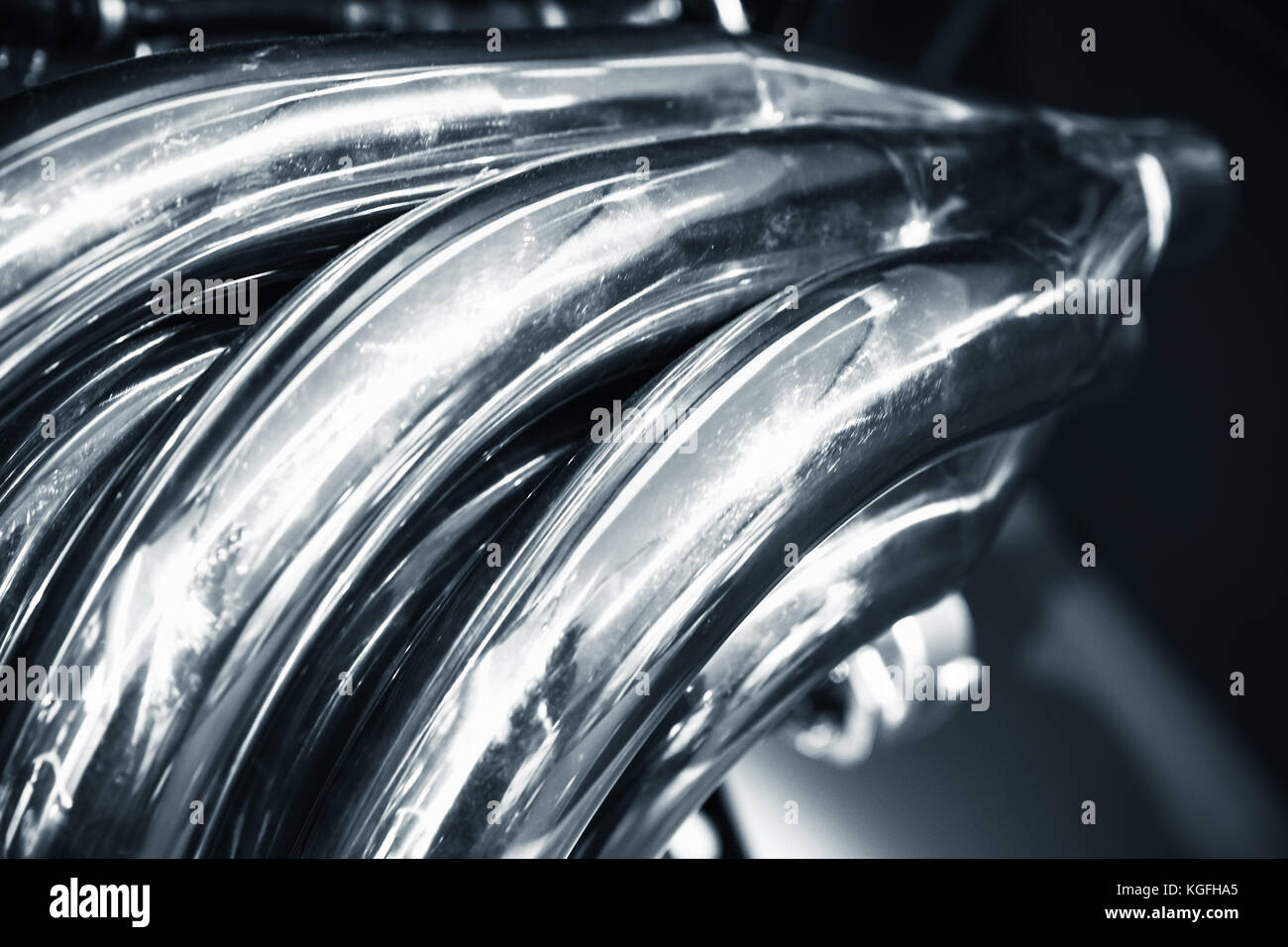 Bent air exhaust pipes. Shiny motor parts, V12 engine fragment, closeup ...