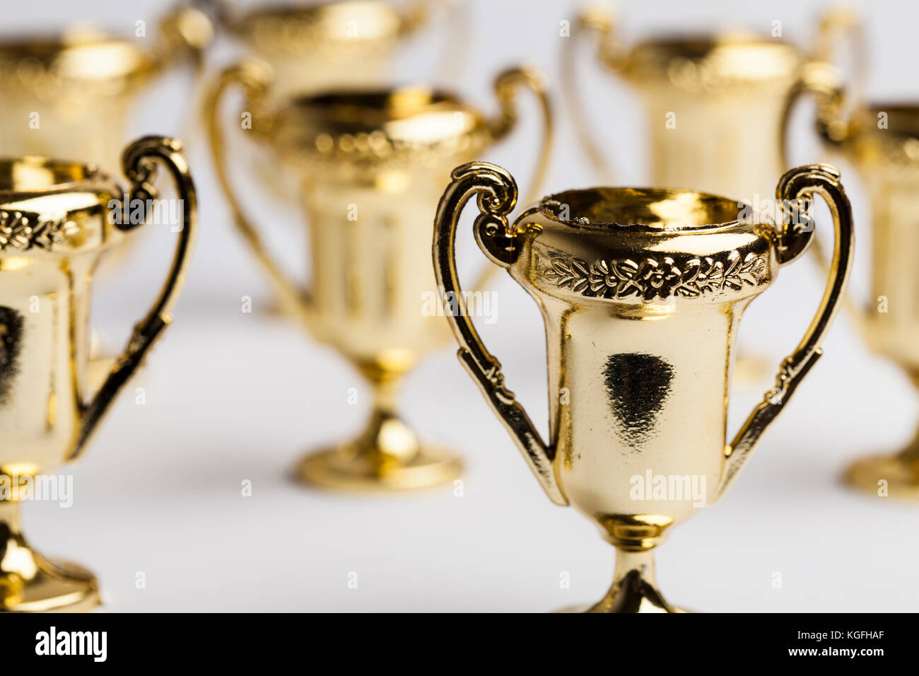 Gold winners achievement trophy background Stock Photo - Alamy