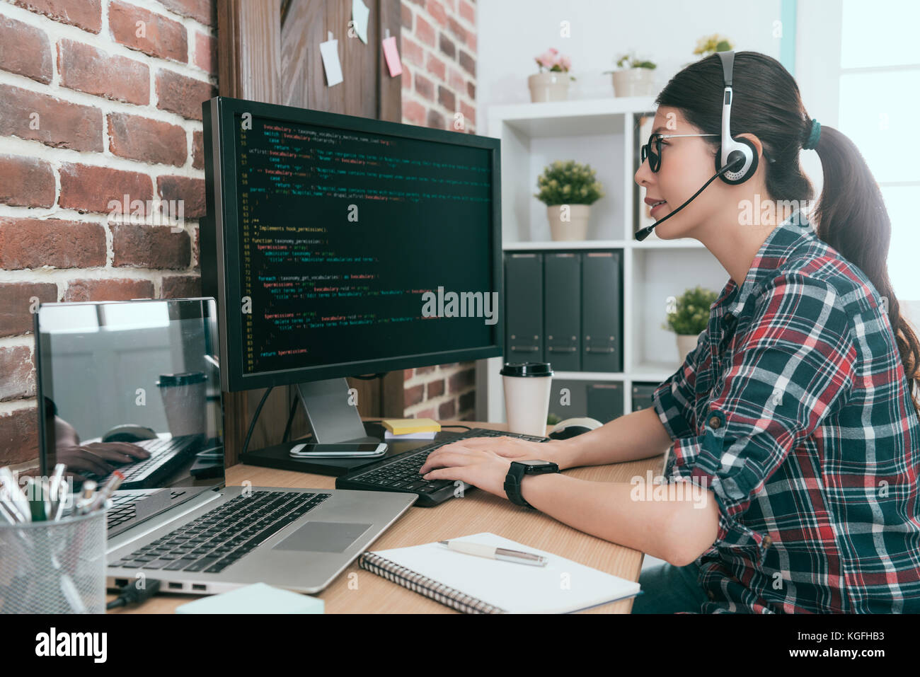 smiling friendly woman operator monitoring customer computer through ...