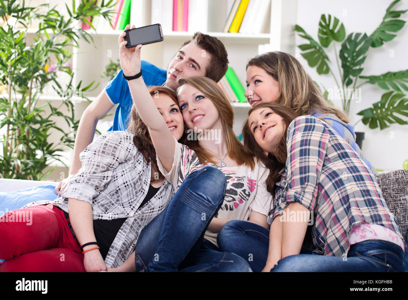 Happy teenagers taking group photo with smartphone Stock Photo - Alamy