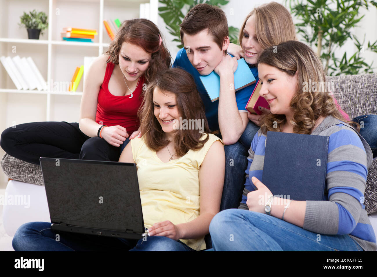 Young group of students discussing their homework Stock Photo - Alamy
