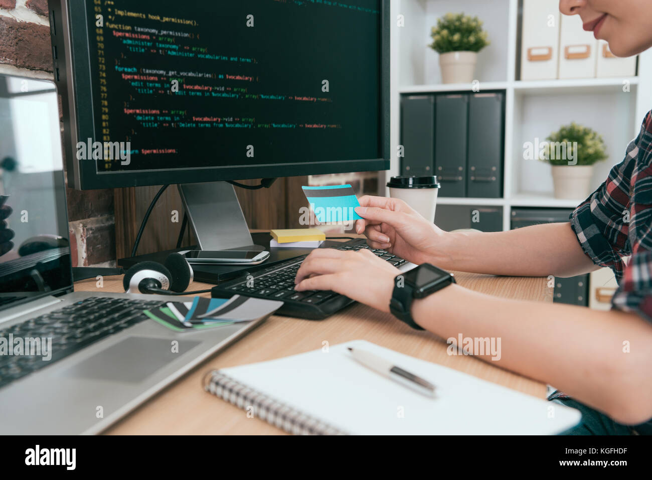closeup photo of young smiling woman programmer using data code hacking ...