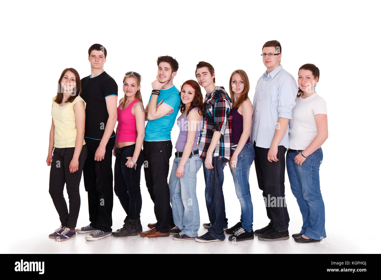 group of casual happy people smiling and standing isolated over a white ...