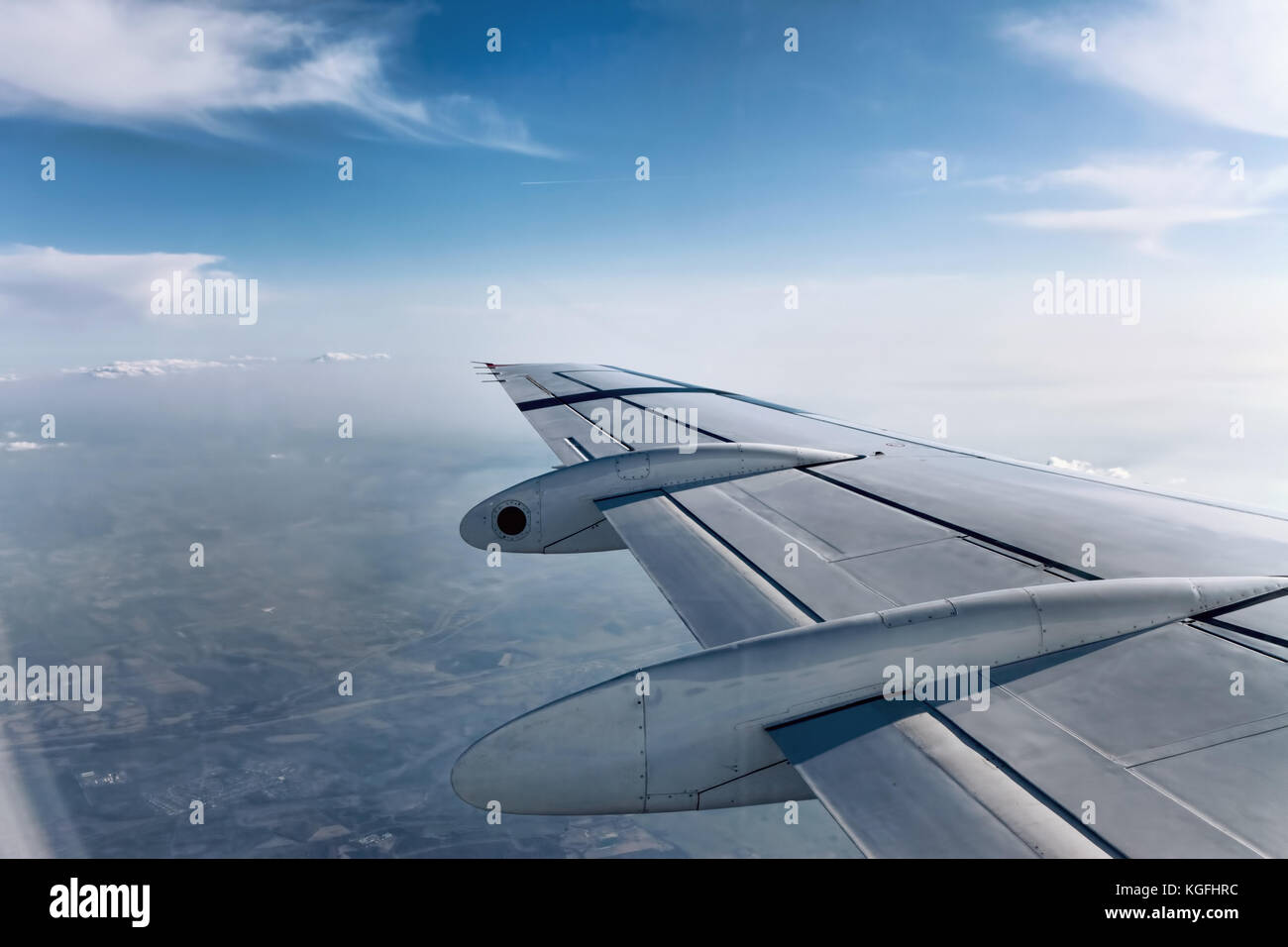Airplane Wing in Flight, looking through window Stock Photo - Alamy