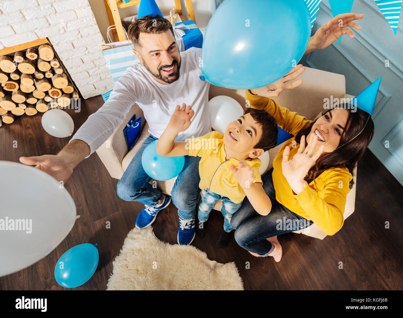 Joyful family throwing balloons during birthday party Stock Photo - Alamy