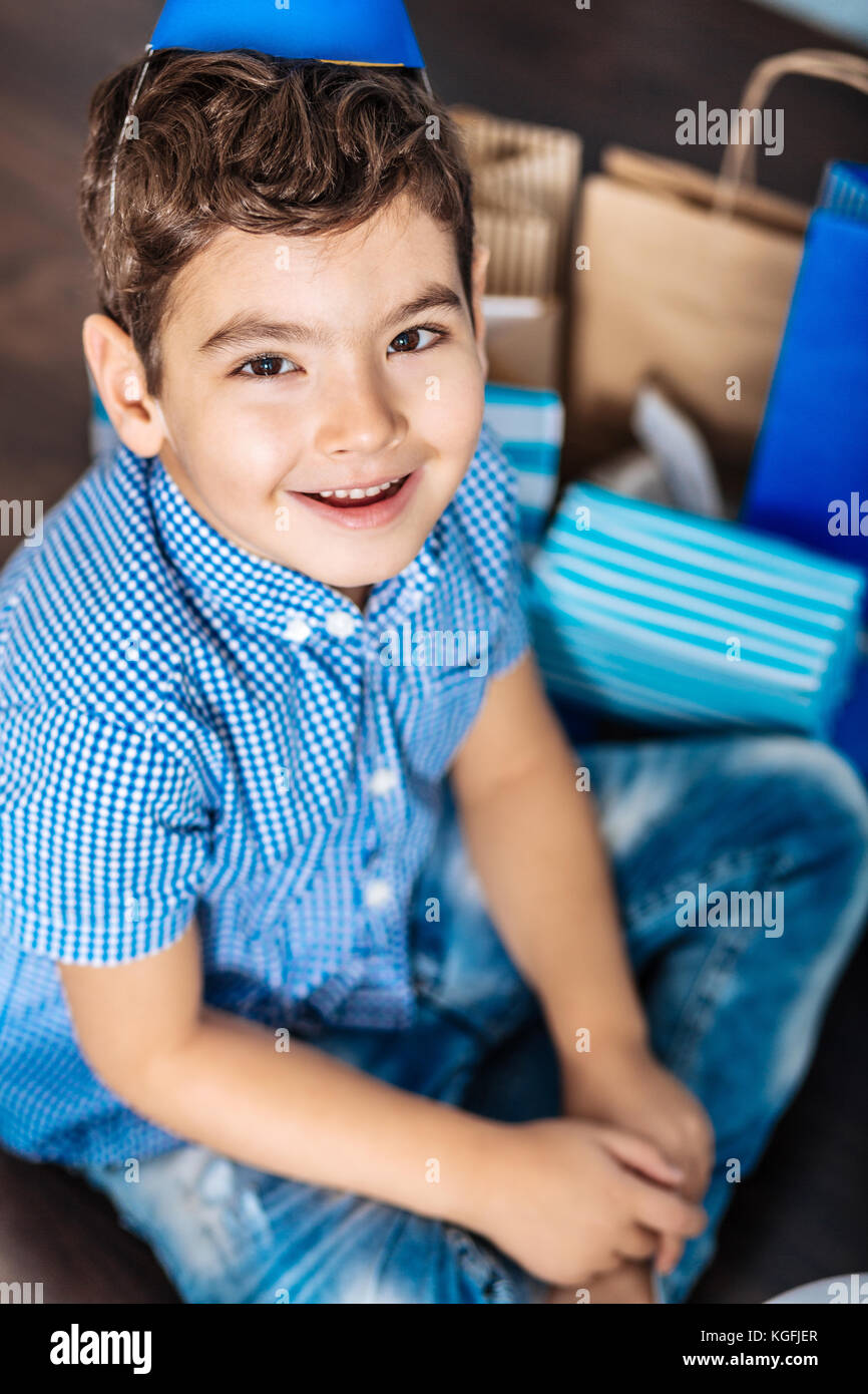 Top view of little boy sitting on floor and smiling Stock Photo - Alamy