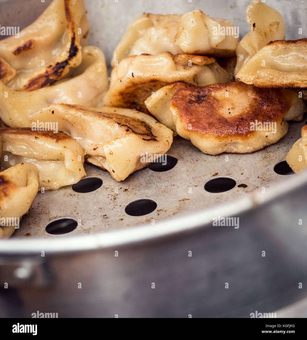 Filled fried dumplings, food market display Stock Photo - Alamy