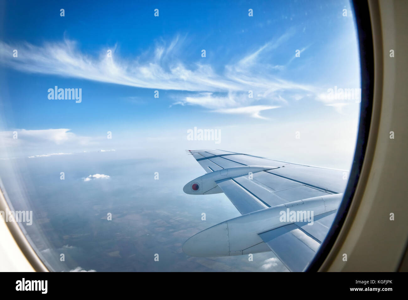 Looking through window aircraft during flight in wing with a nice blue ...