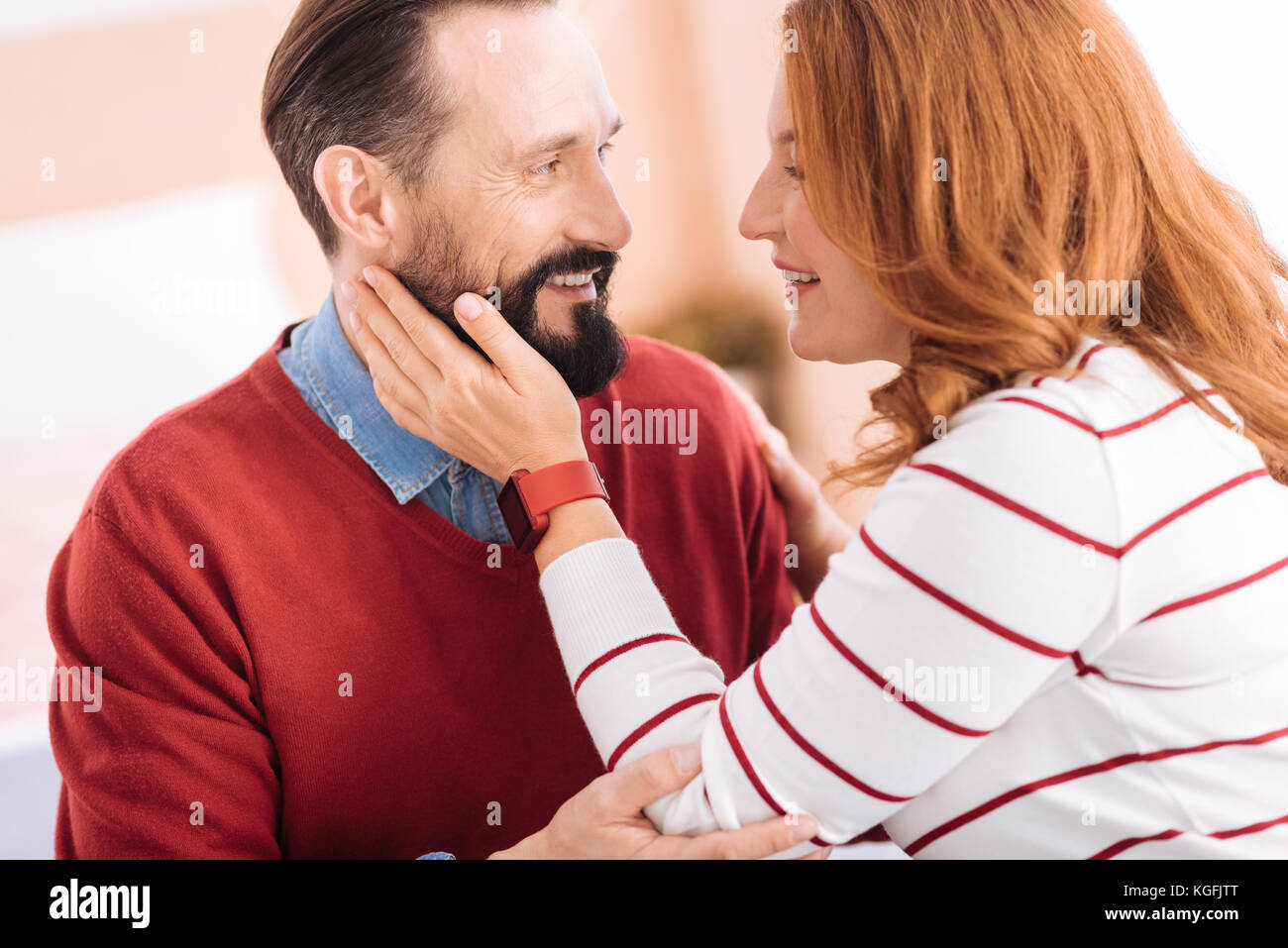 Cheerful man and woman caressing each other Stock Photo - Alamy
